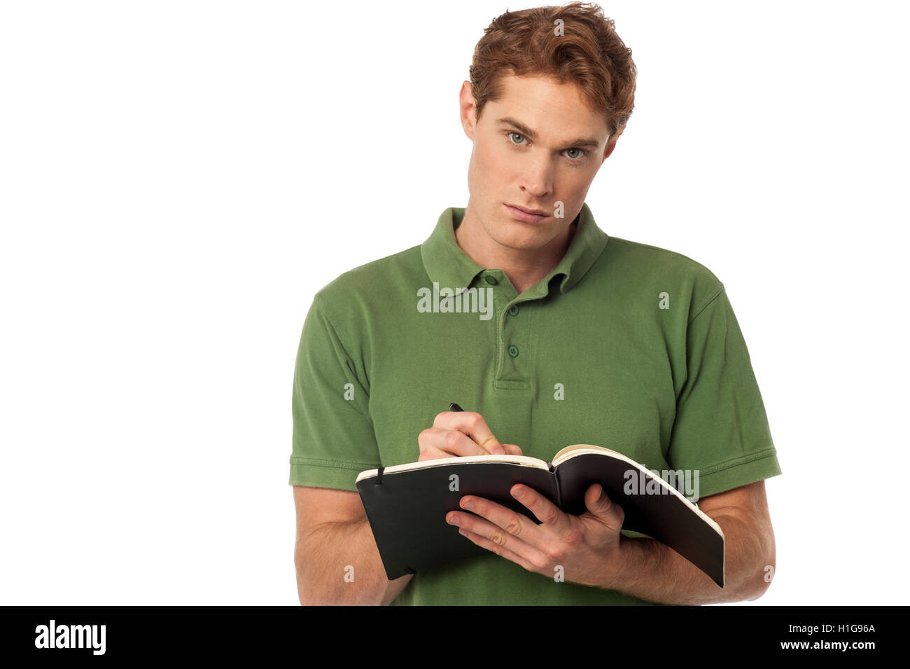 Man writing on the notebook Stock Photo - Alamy