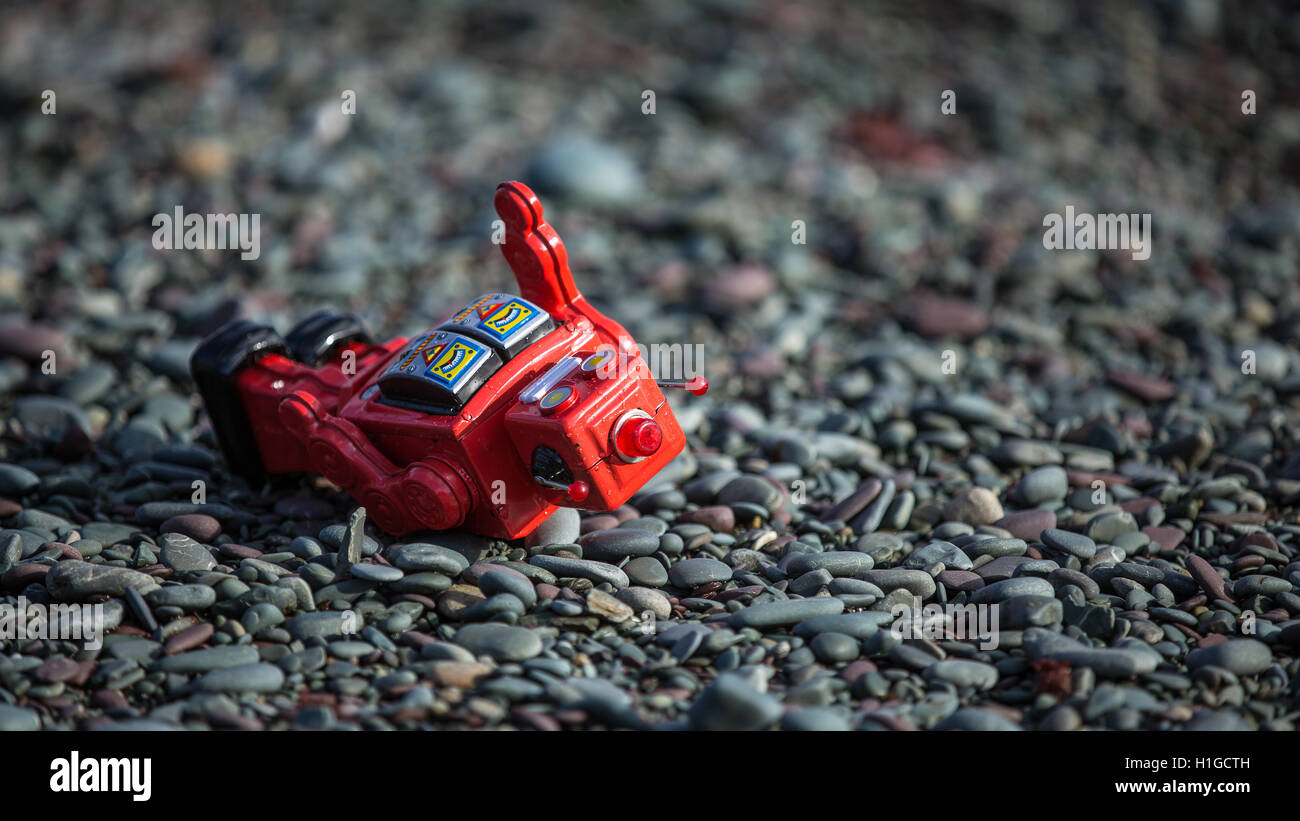 Knocked over by a rogue wave, the red robot is down, but not defeated ...