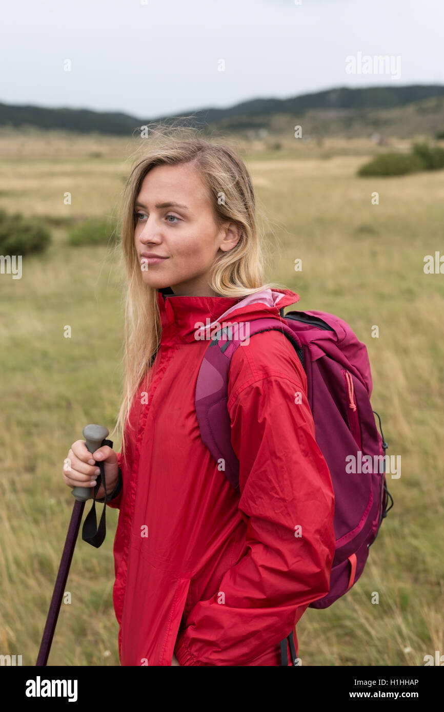 Woman Traveler with Backpack hiking in Mountains with beautiful summer ...