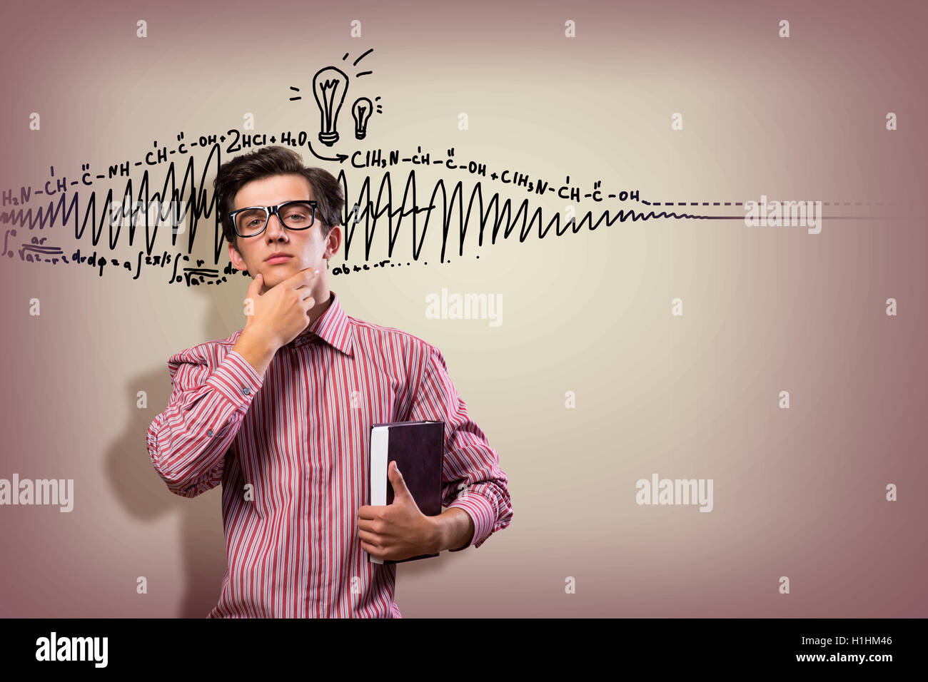 young man scientist with glasses thinking Stock Photo - Alamy