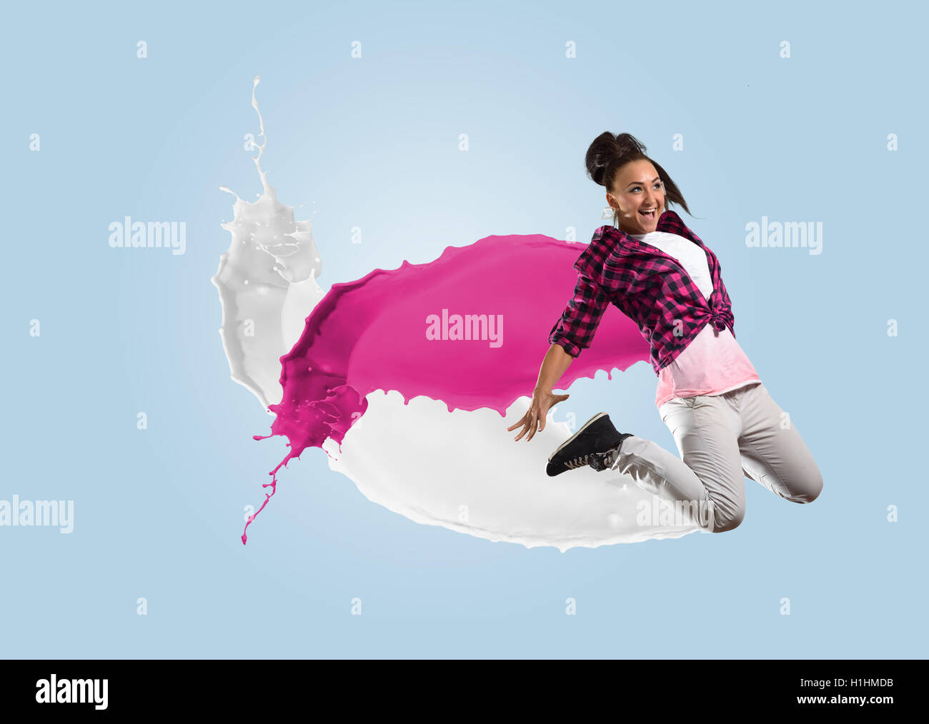 young female dancer jumping with splash of paint Stock Photo - Alamy