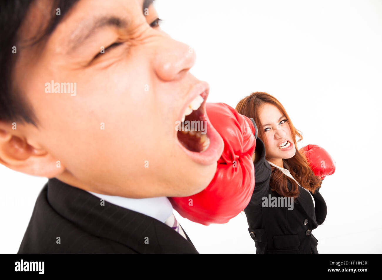 businesswoman hitting businessman isolated on white background Stock ...