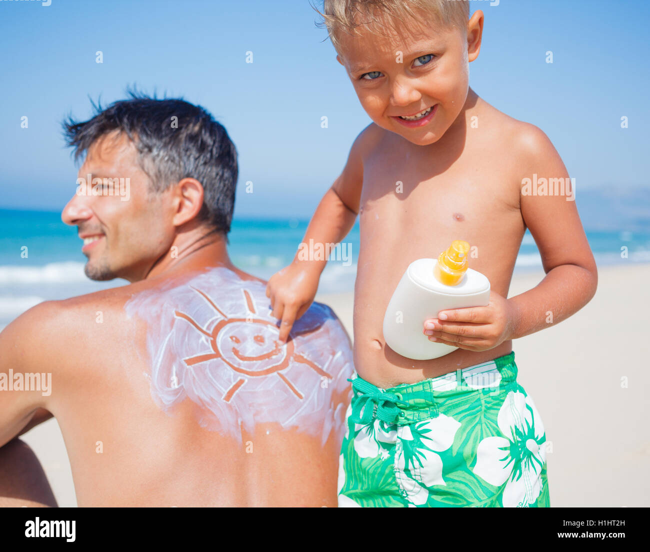 Father sun cream hi-res stock photography and images - Alamy