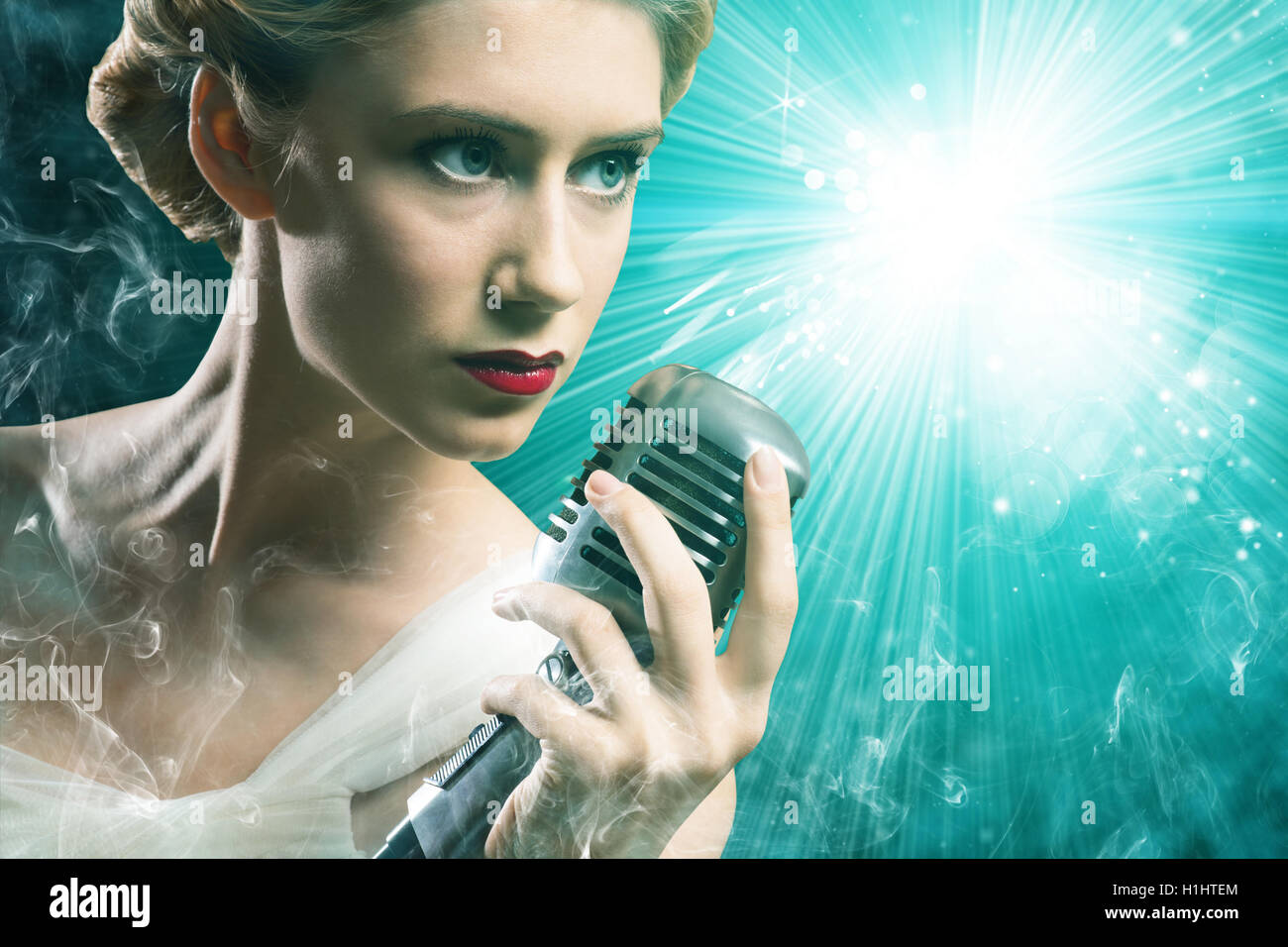 attractive female singer with microphone Stock Photo - Alamy