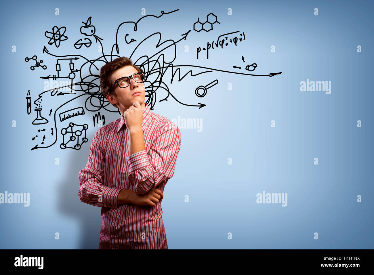 young man scientist with glasses thinking Stock Photo - Alamy