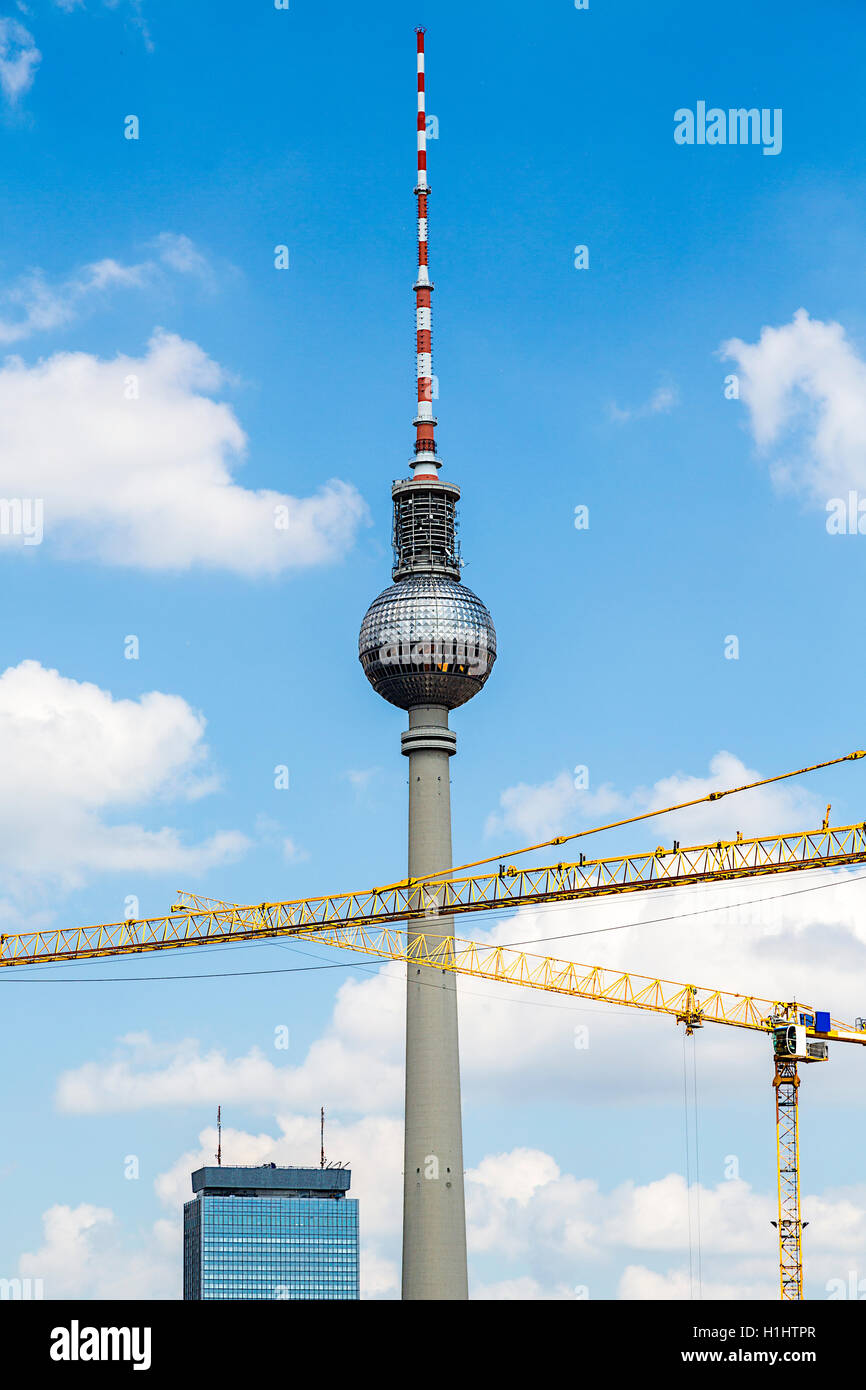 berlin tv tower with two building cranes Stock Photo - Alamy