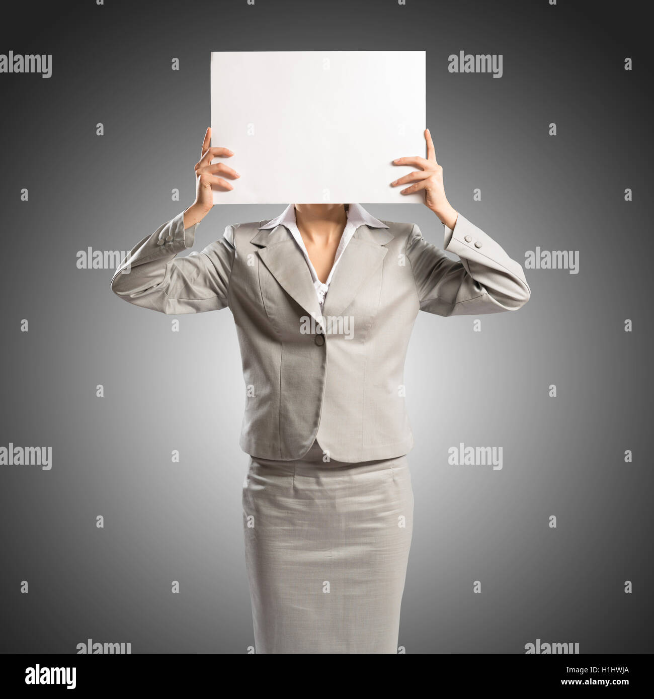 business woman holding a poster Stock Photo - Alamy
