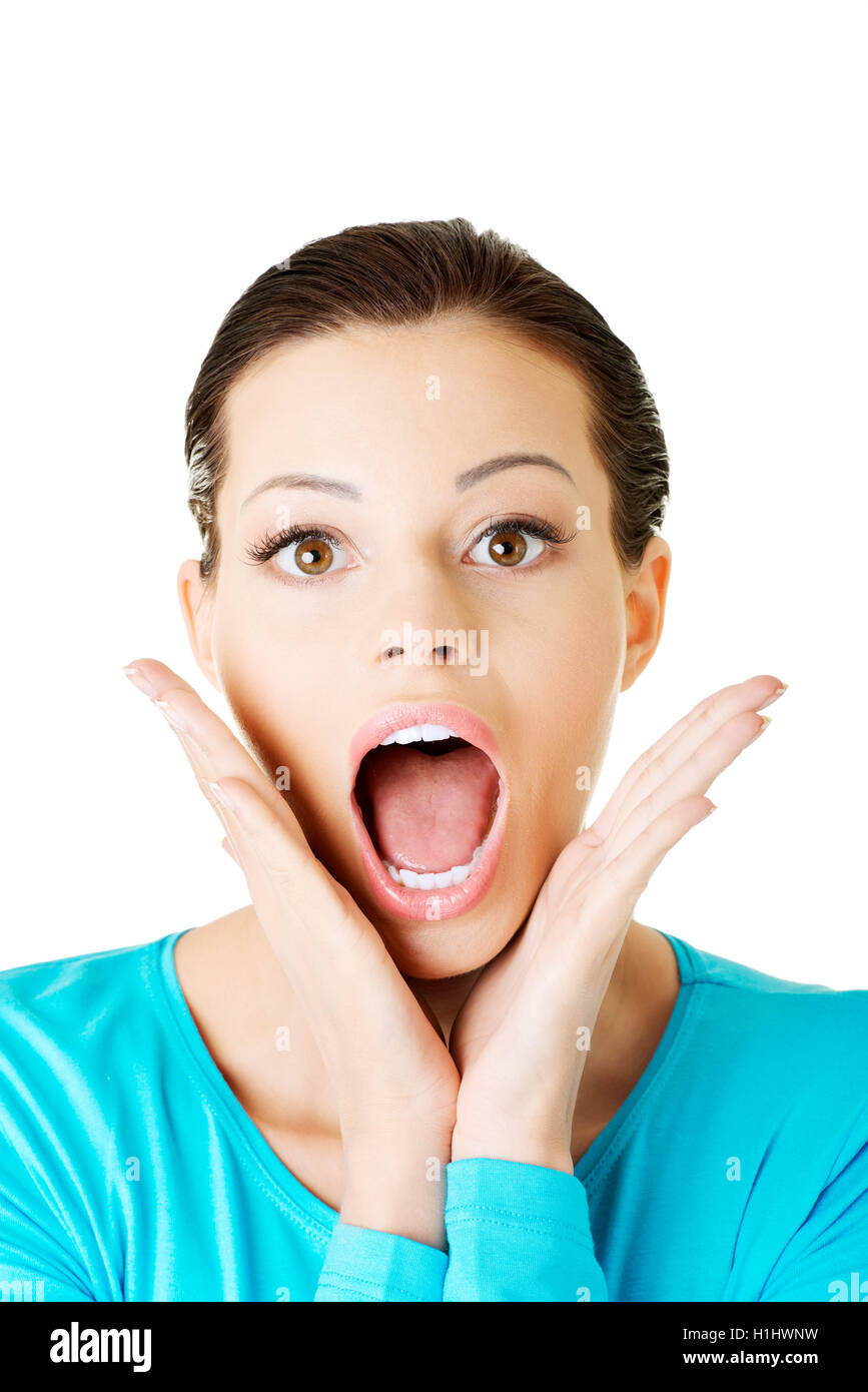 Beautiful casual woman expresses shock Stock Photo - Alamy