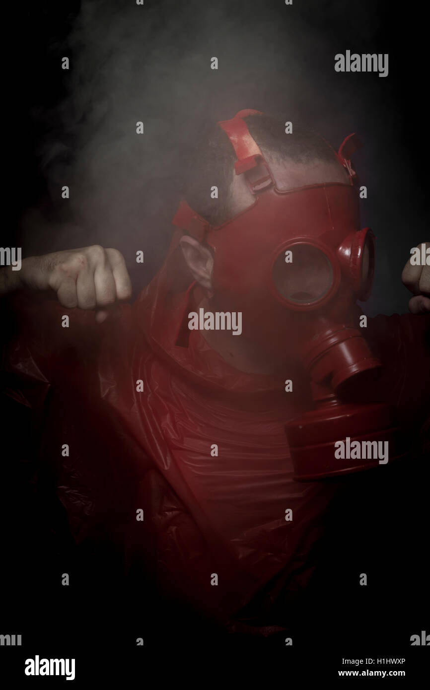 Nuclear, A man in a gas mask over the smoke. black background a Stock ...