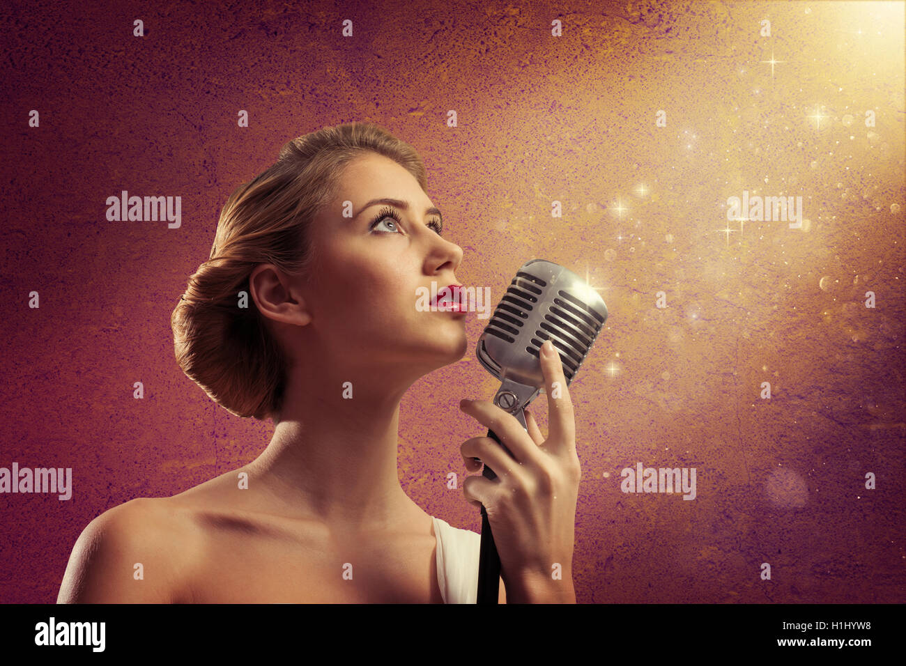 attractive female singer with microphone Stock Photo - Alamy