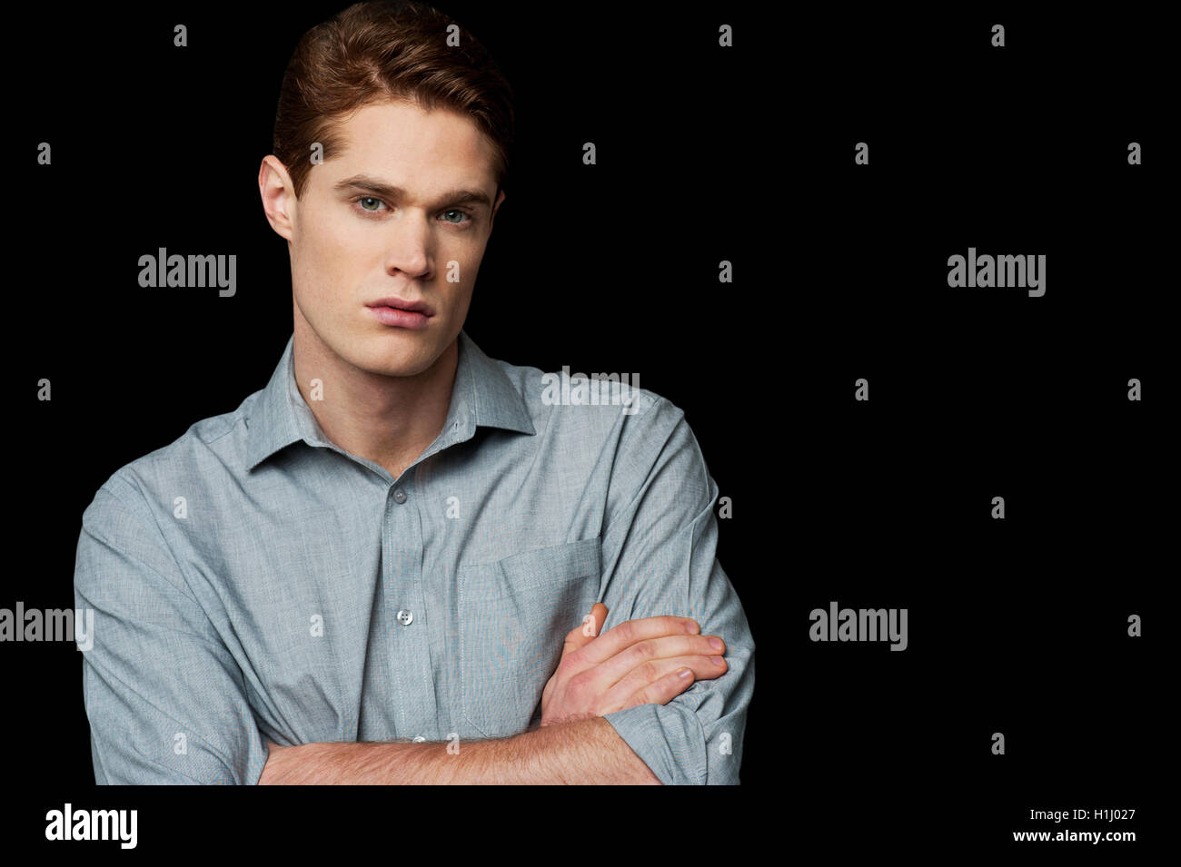 Confident young smart guy Stock Photo - Alamy