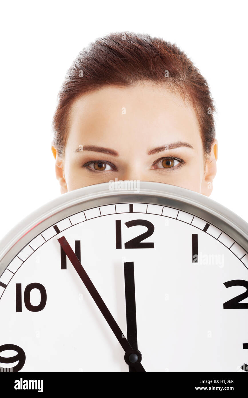 Young beautiful business woman holding clock Stock Photo - Alamy