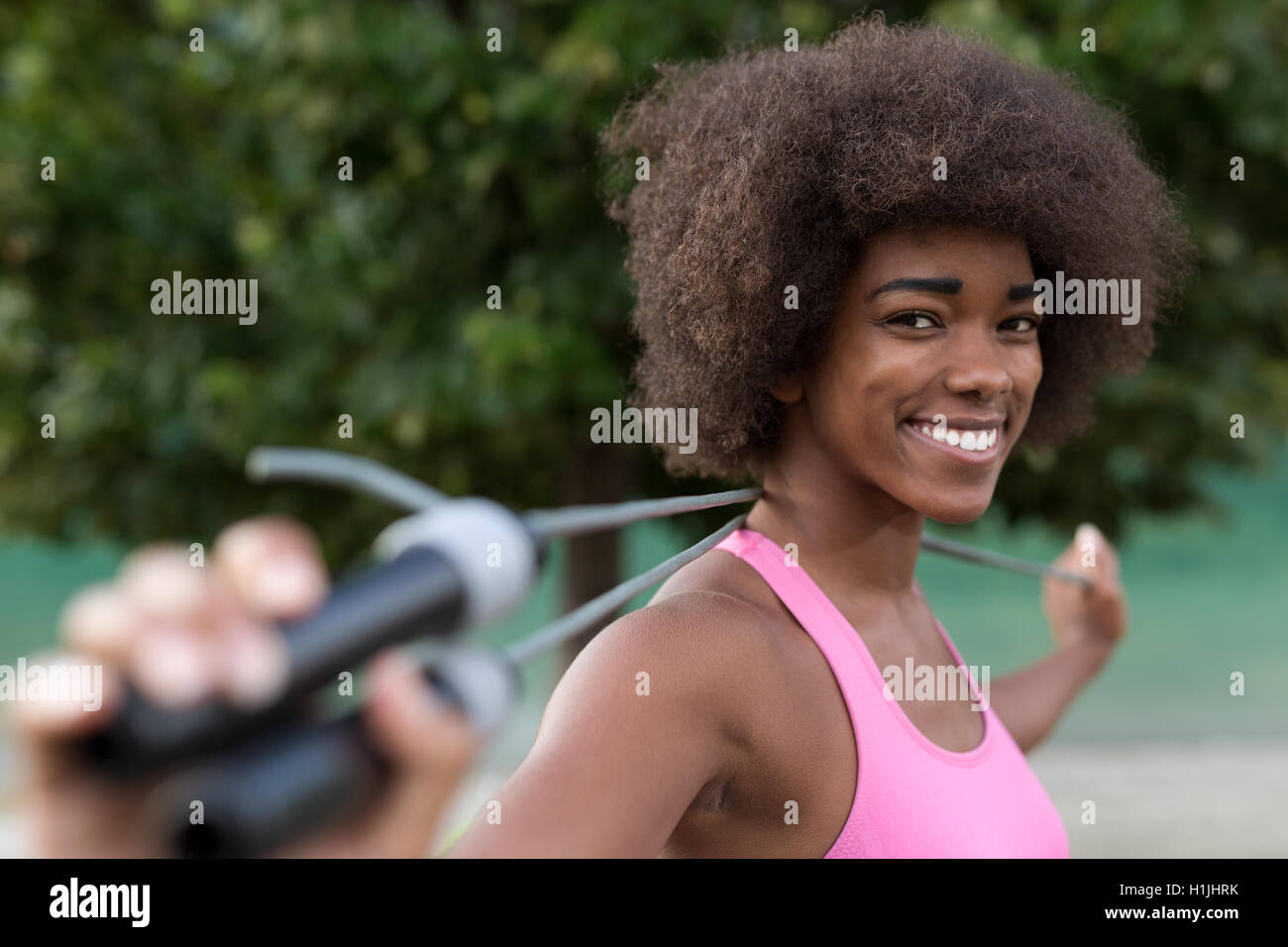 portrait of afro american woman with jump rope Stock Photo - Alamy