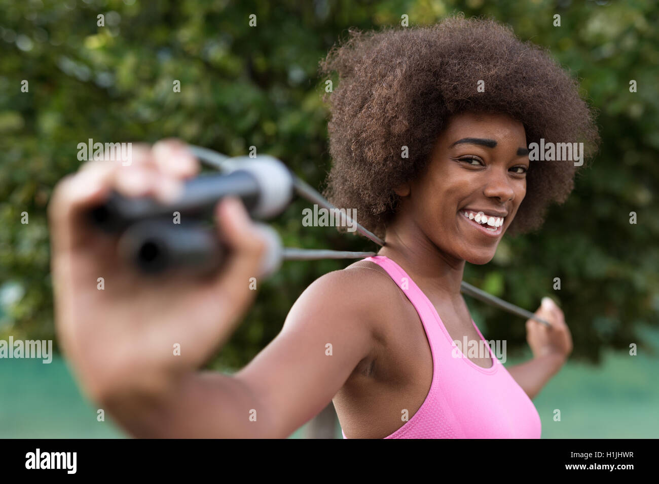 portrait of afro american woman with jump rope Stock Photo - Alamy