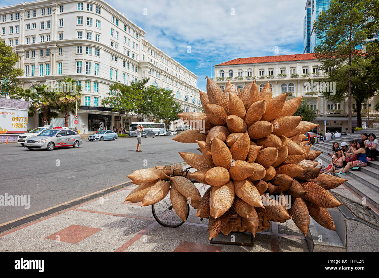 Traditional bamboo fish traps tied to a bike for transportation ...