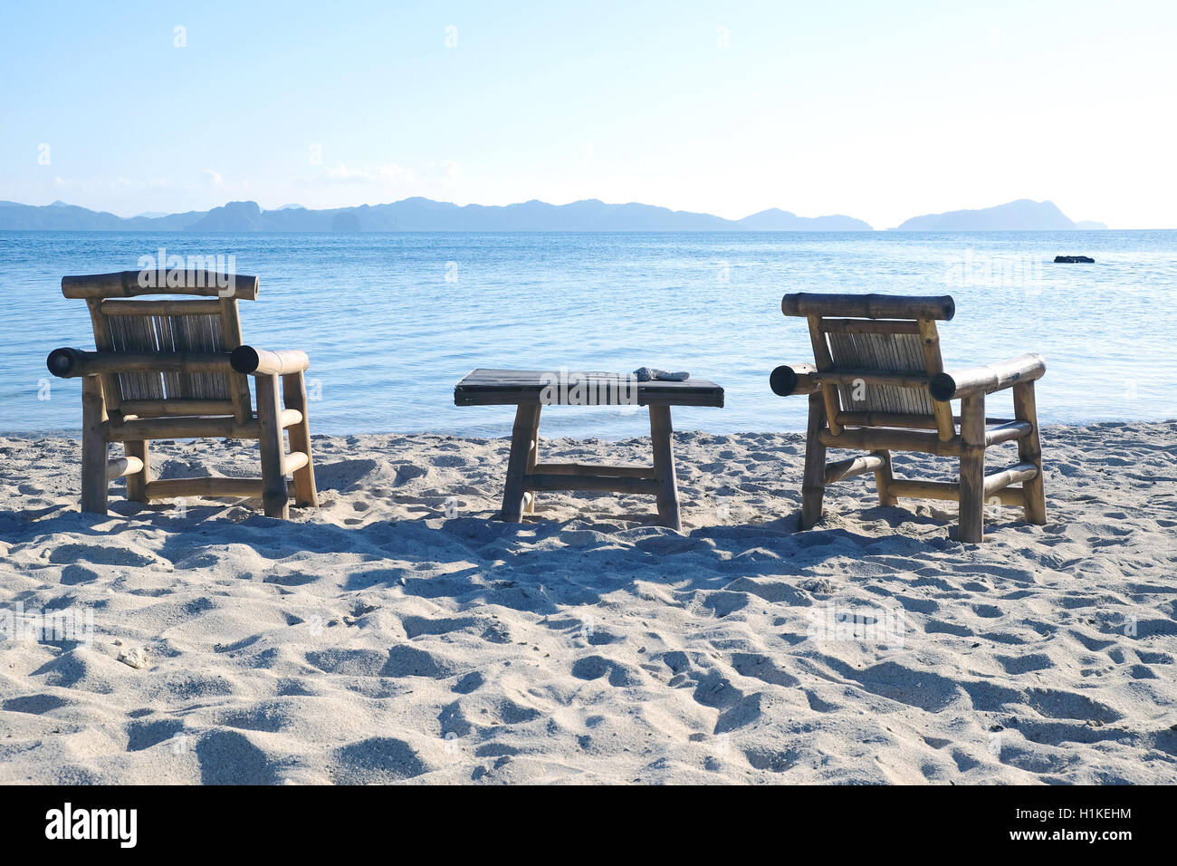 Wooden beach chairs in Palawan island, Philippines Stock Photo - Alamy