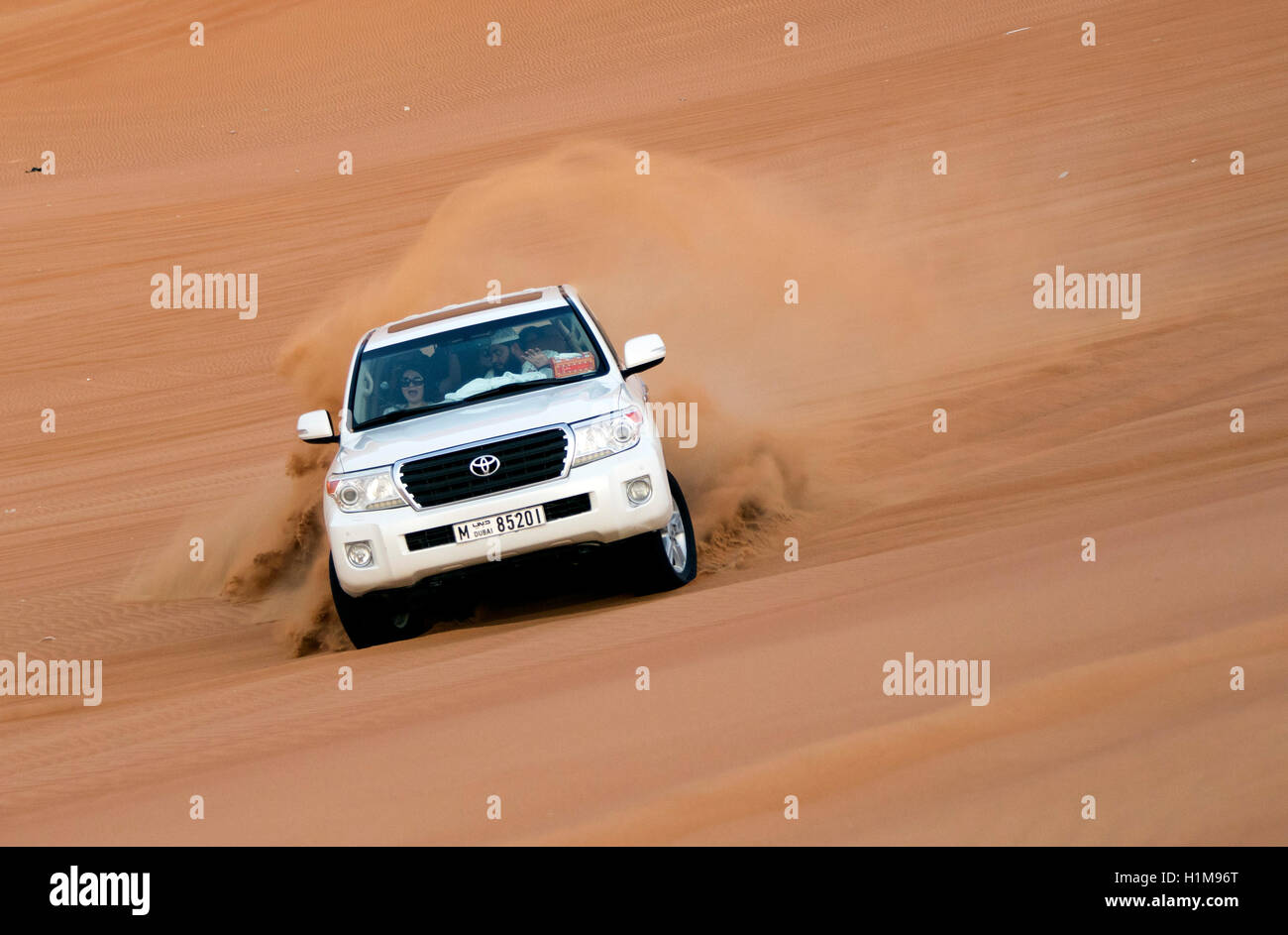 Desert safari dune bashing tour tourist fun Dubai Stock Photo - Alamy