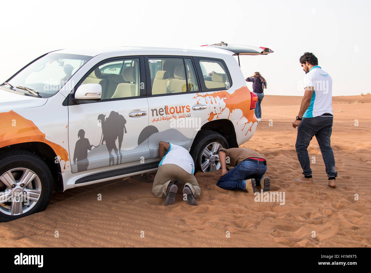 Desert safari dune bashing tour tourist fun Dubai Stock Photo - Alamy