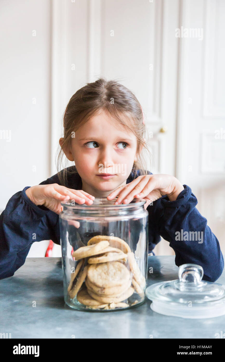 Girl reaching for cookies hi-res stock photography and images - Alamy