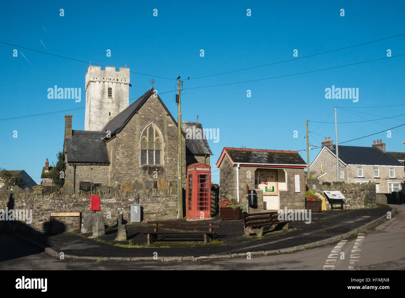 Ancient church and bell tower in centre of village of Llansaint,a ...