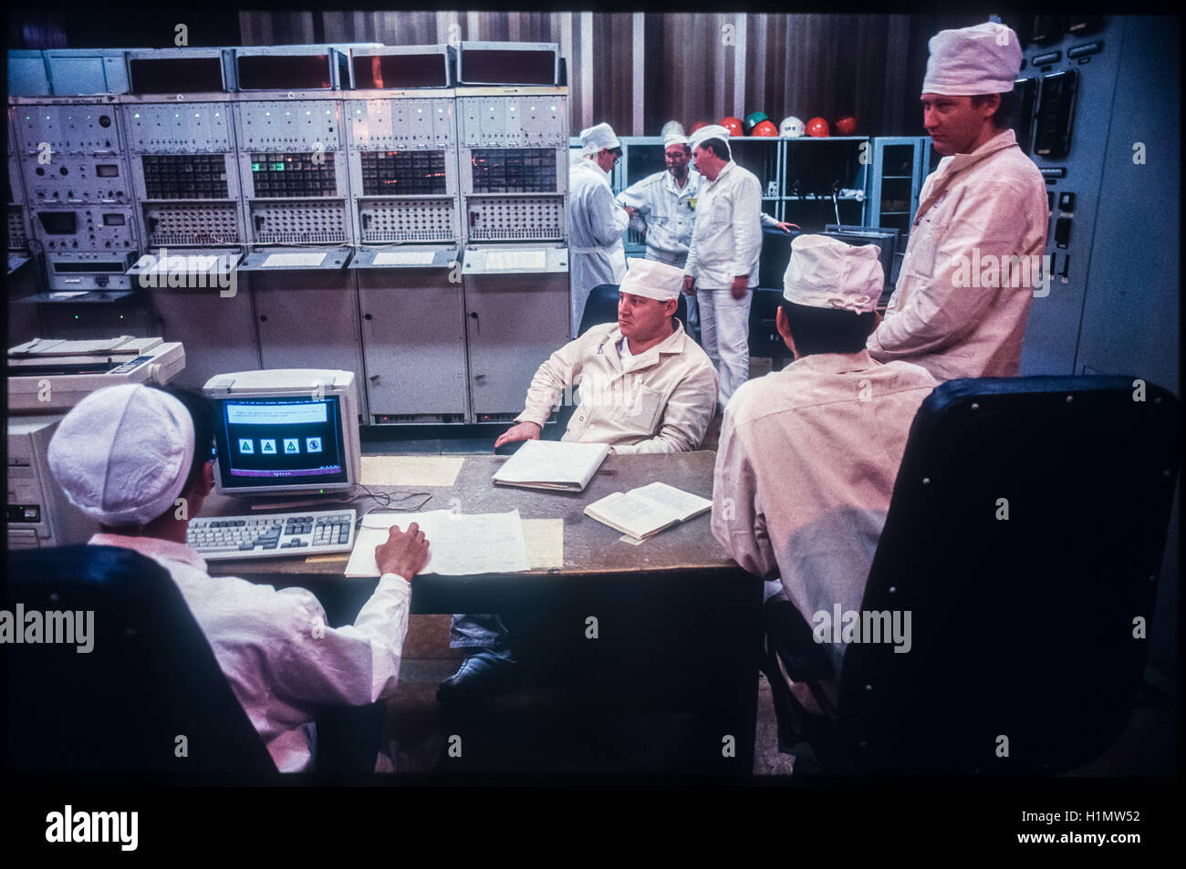 Technicians in a control room of nuclear power station of Tchernobyl ...