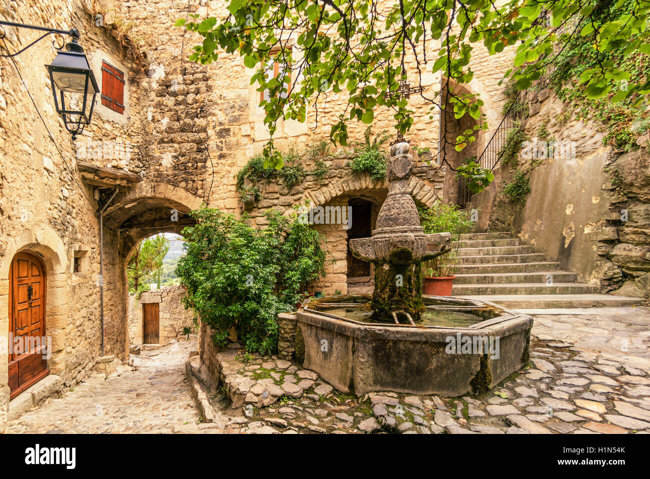 Historic Fountain in courtyard, Le Crestet, Vaucluse, France, Europe ...
