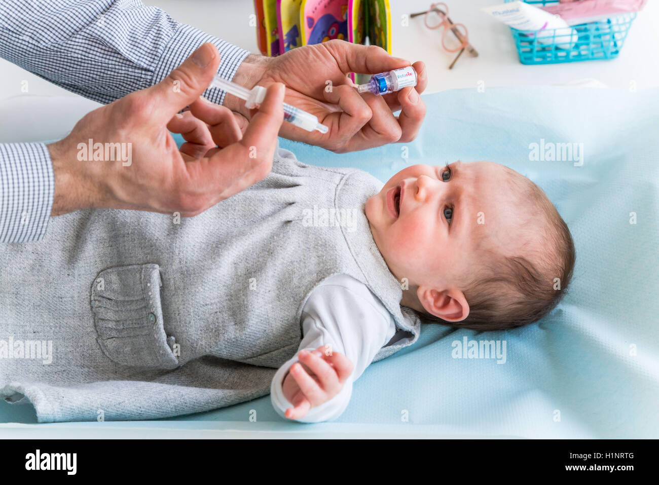3 months old baby receiving Rotarix vaccination against gastroenteritis ...