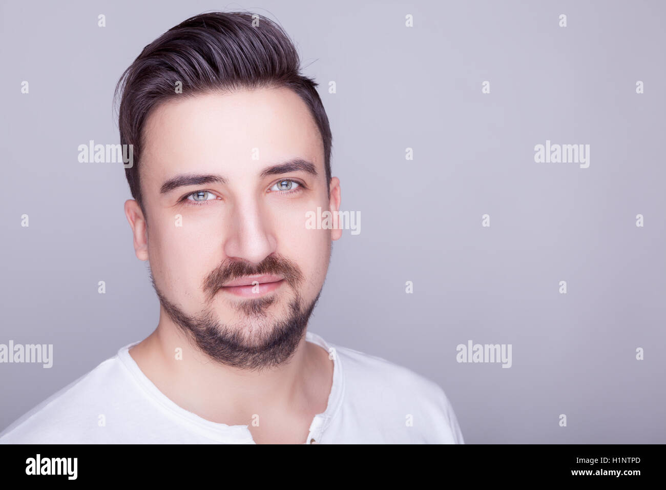 Young men with style on grey background in studio photo Stock Photo - Alamy