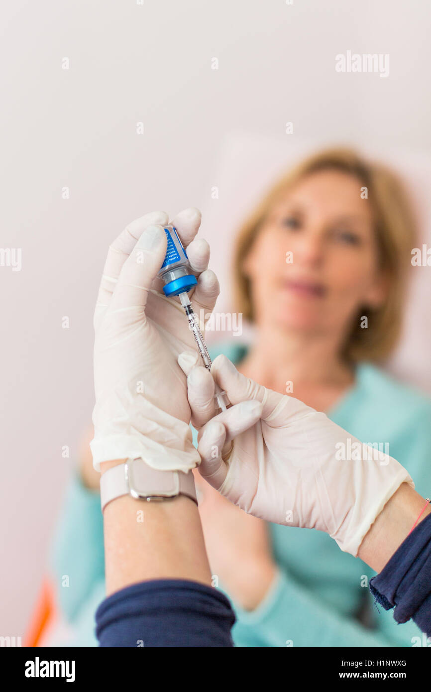 Woman receiving botox injections for treatment of wrinkles Stock Photo ...