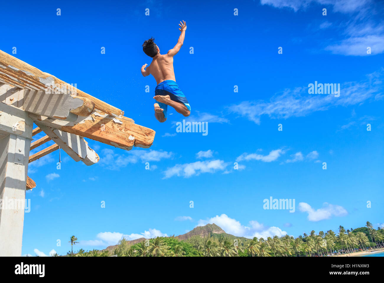 Jumping from Waikiki Pier Stock Photo - Alamy