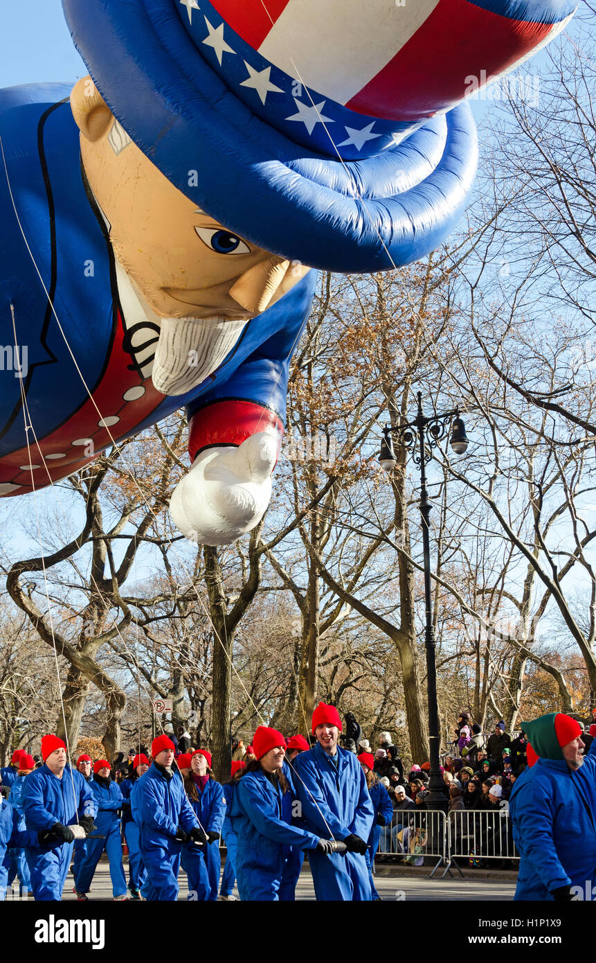 A team of handlers leads the Uncle Sam balloon down Central Park West ...