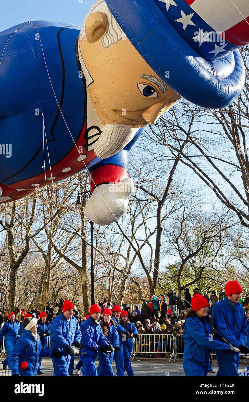 A team of handlers leads the Uncle Sam balloon down Central Park West ...