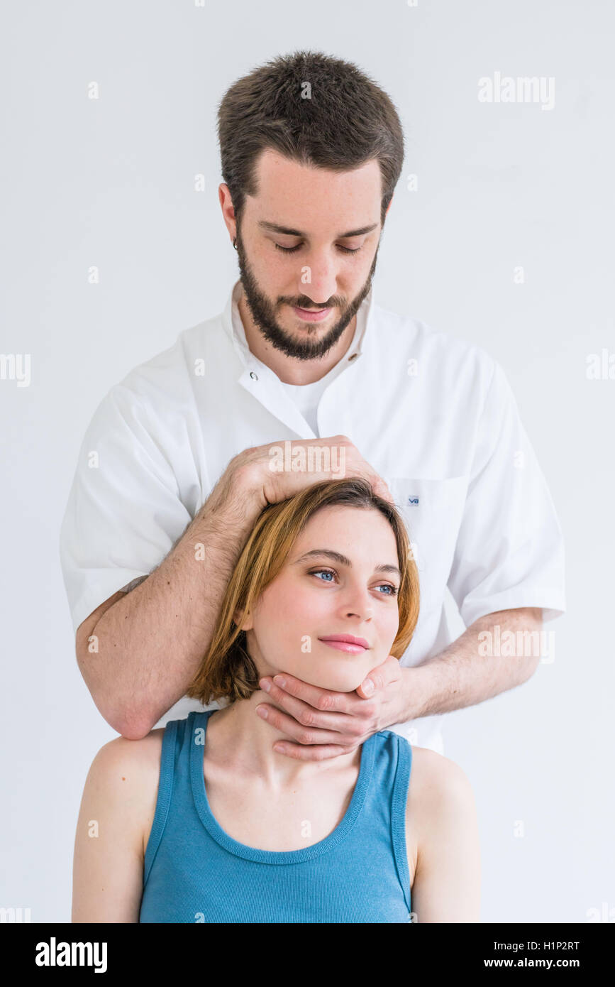 Structural osteopathy session in a woman suffering from neck pain Stock ...