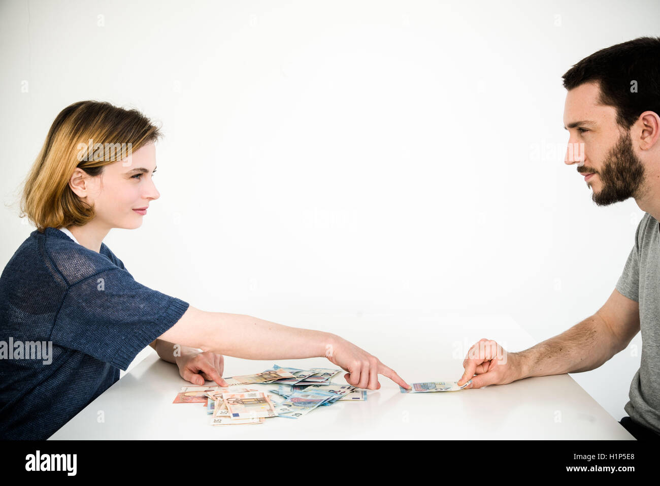 Couple and money Stock Photo - Alamy