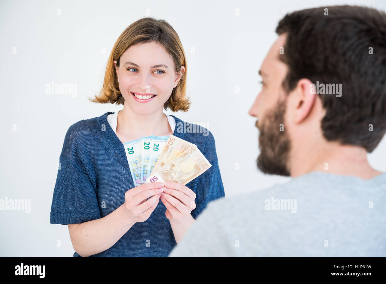 Couple and money Stock Photo - Alamy