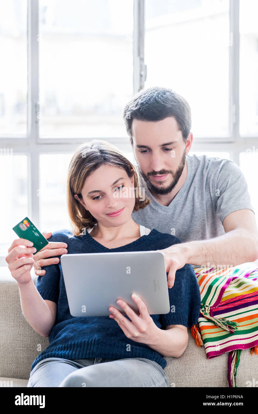 Couple making online purchase Stock Photo - Alamy