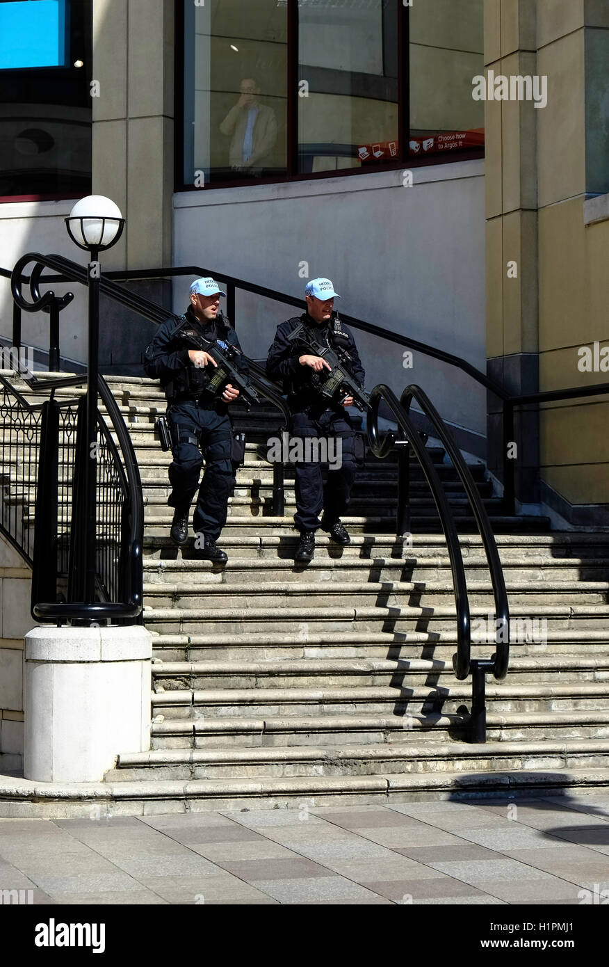 Police carrying guns uk hi-res stock photography and images - Alamy