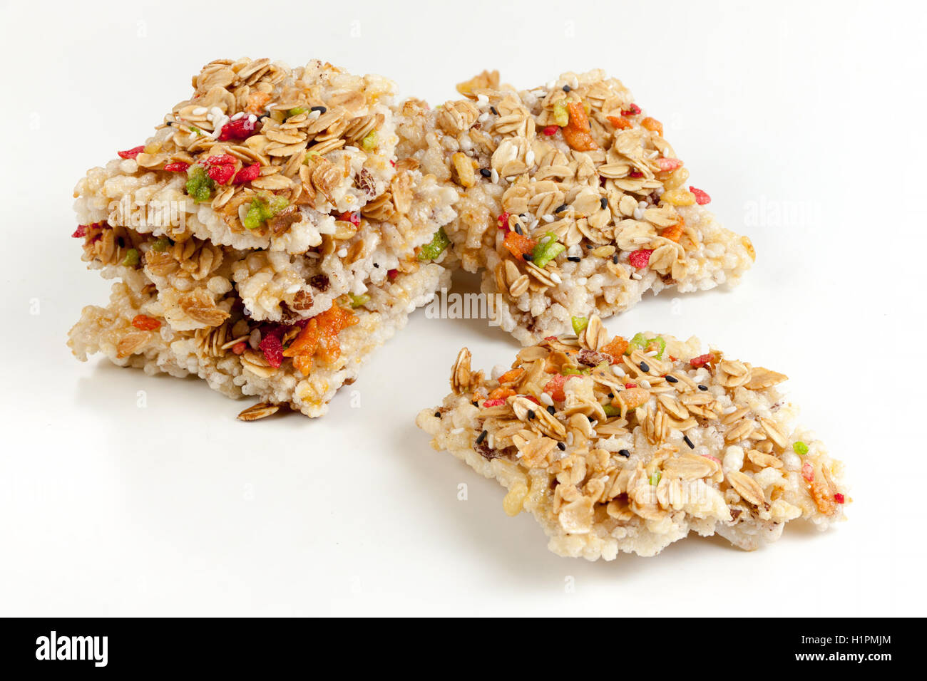 Crispy rice crust with honey topping on grains. many grains on white ...