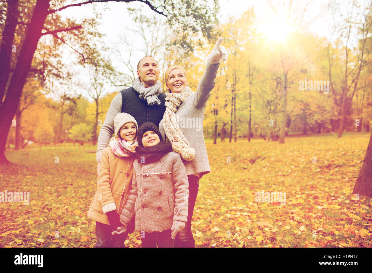 happy family in autumn park Stock Photo - Alamy