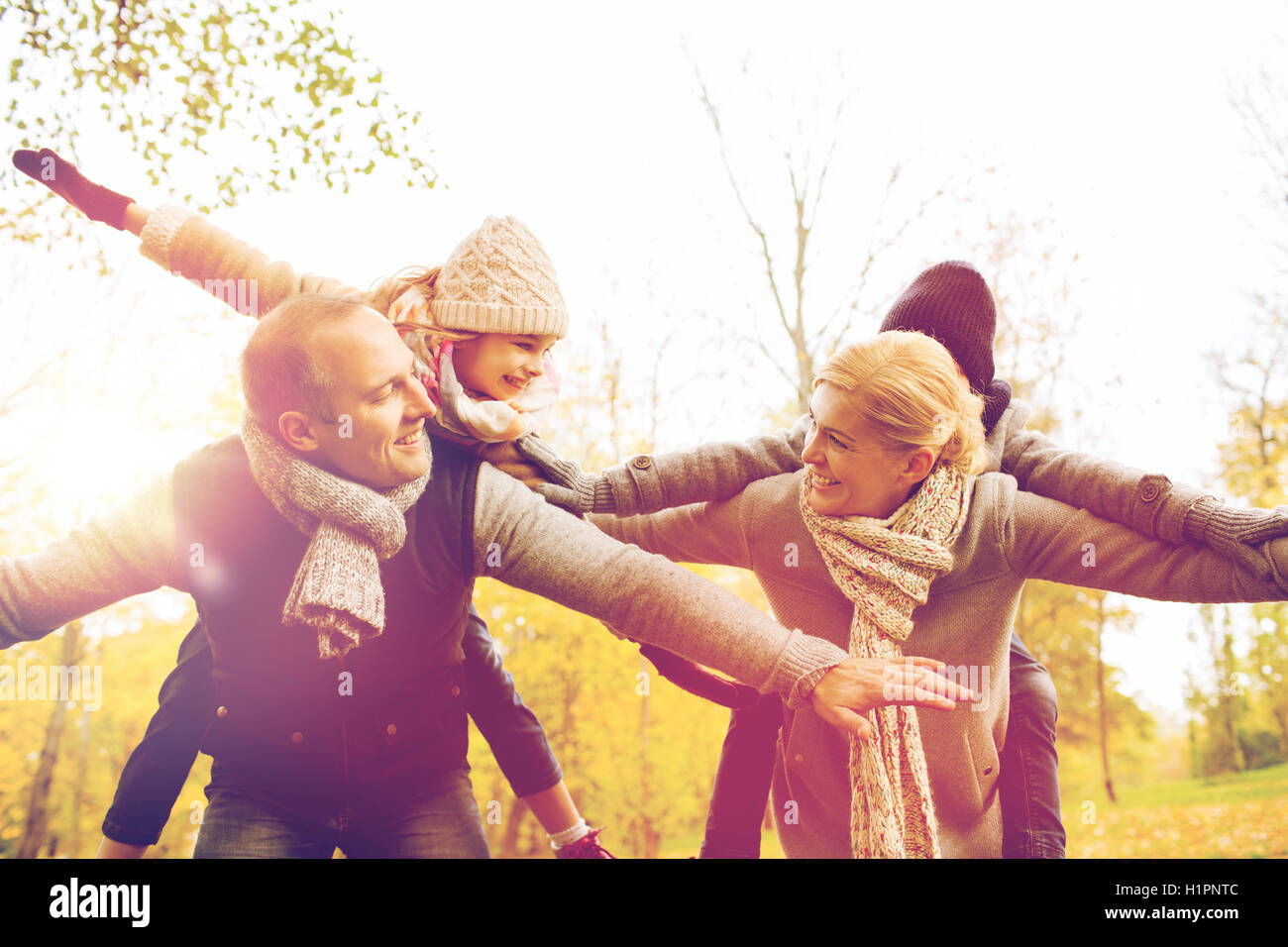 happy family having fun in autumn park Stock Photo - Alamy