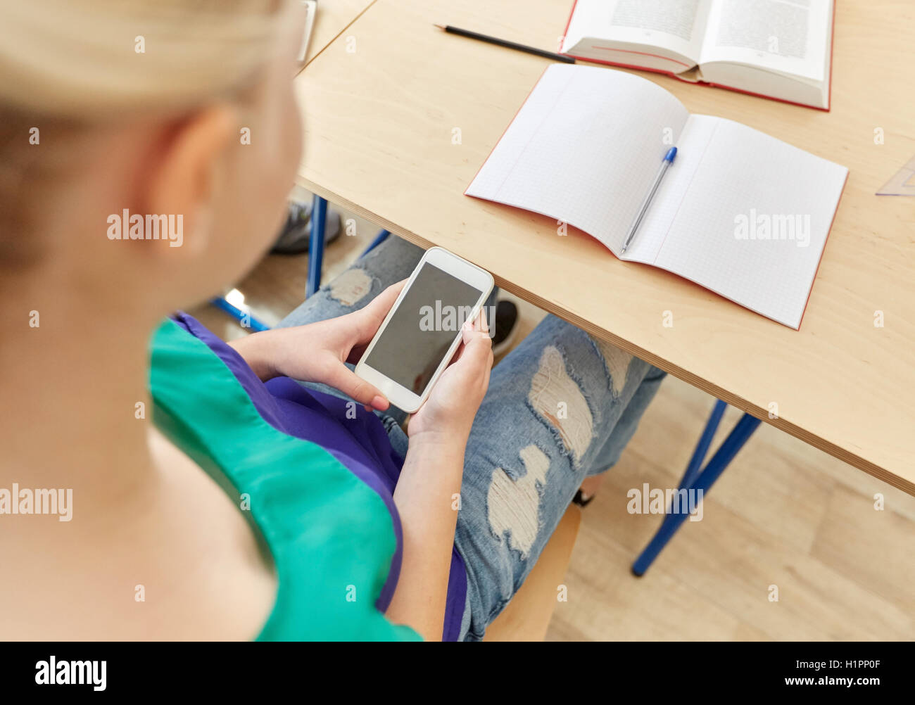 student girl with smartphone texting at school Stock Photo - Alamy