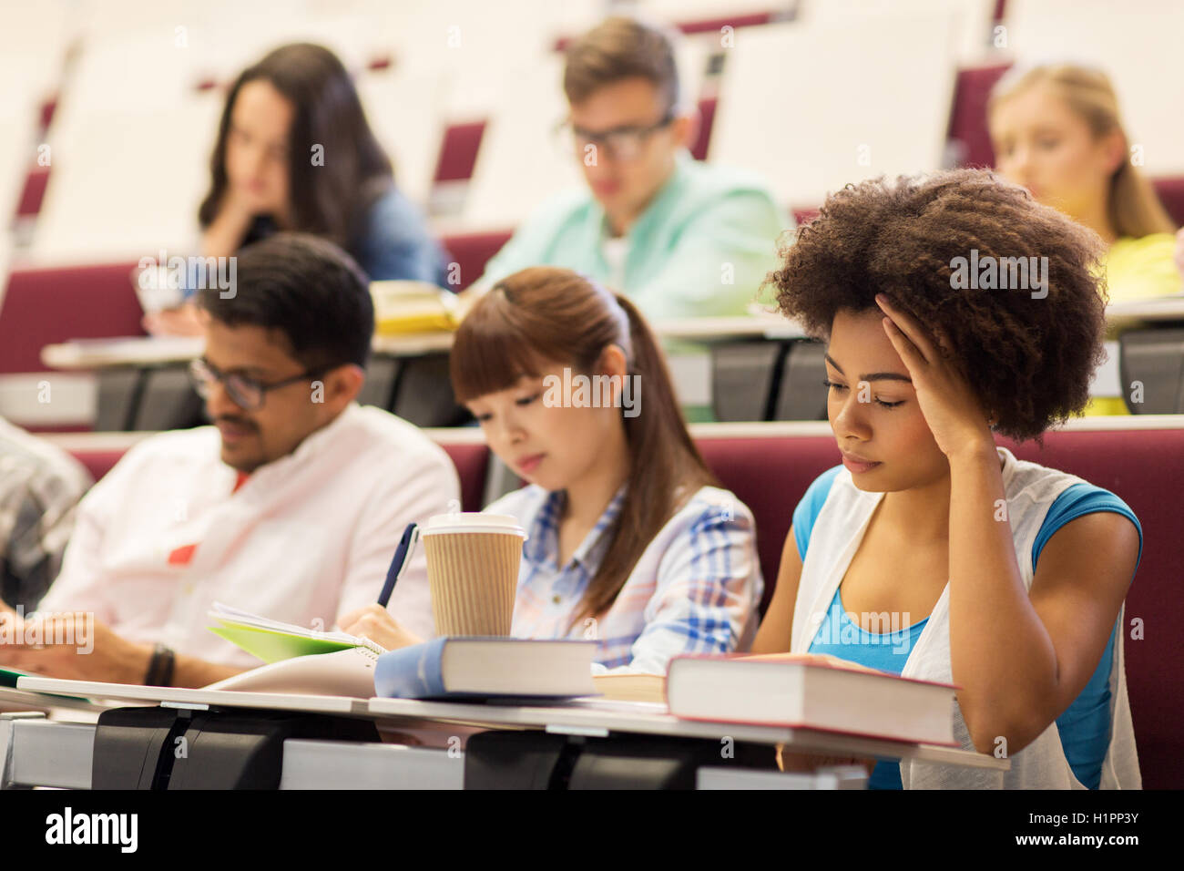 group of students with coffee writing on lecture Stock Photo - Alamy