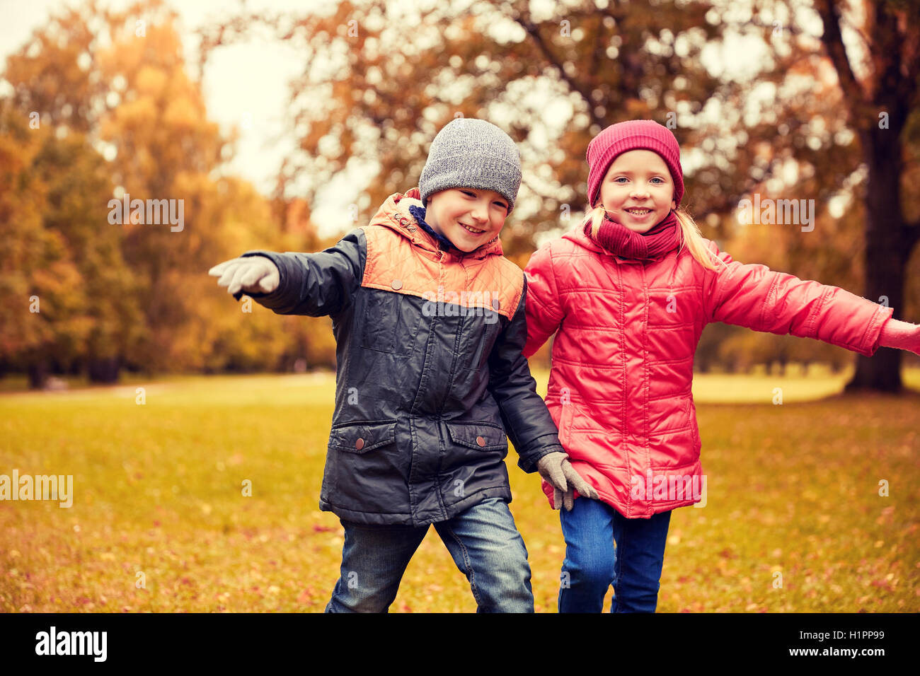happy little children running and playing outdoors Stock Photo - Alamy
