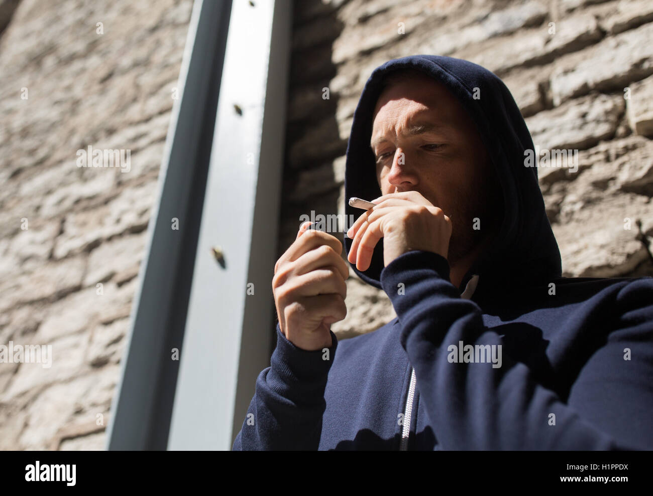 close up of addict smoking marijuana joint Stock Photo - Alamy