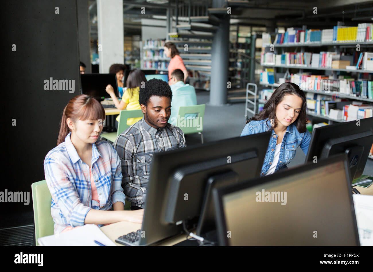 international students with computers at library Stock Photo - Alamy