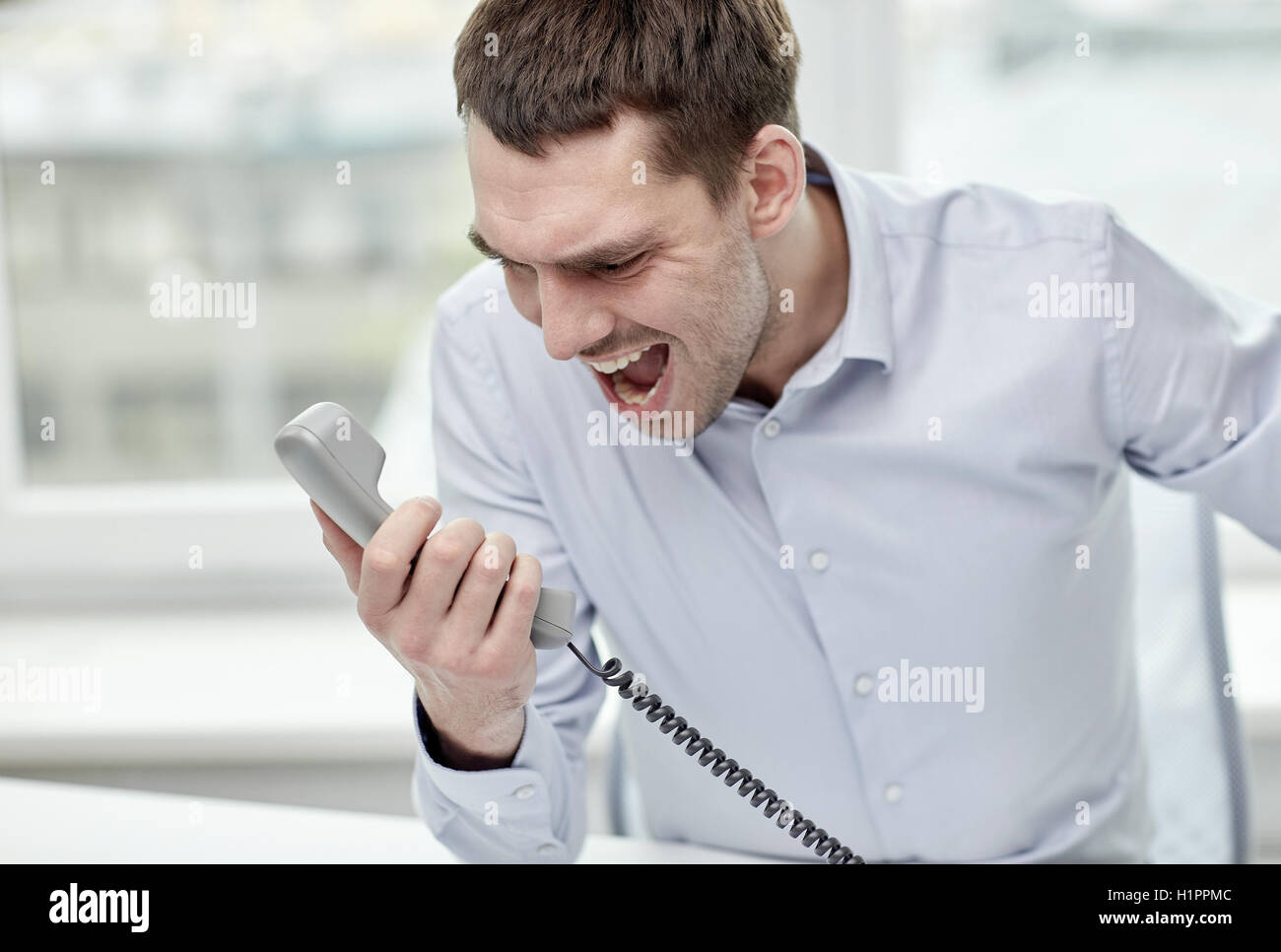 Man yelling office hi-res stock photography and images - Alamy