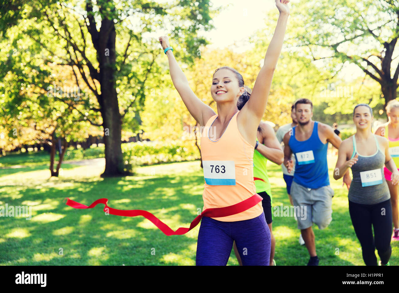 happy young female runner winning on race finish Stock Photo: 121588069 ...