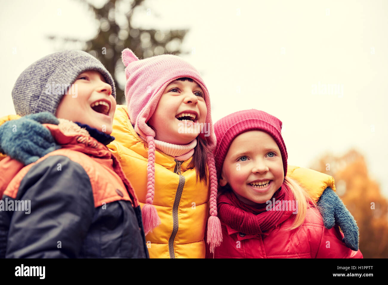 group of happy children hugging in autumn park Stock Photo - Alamy