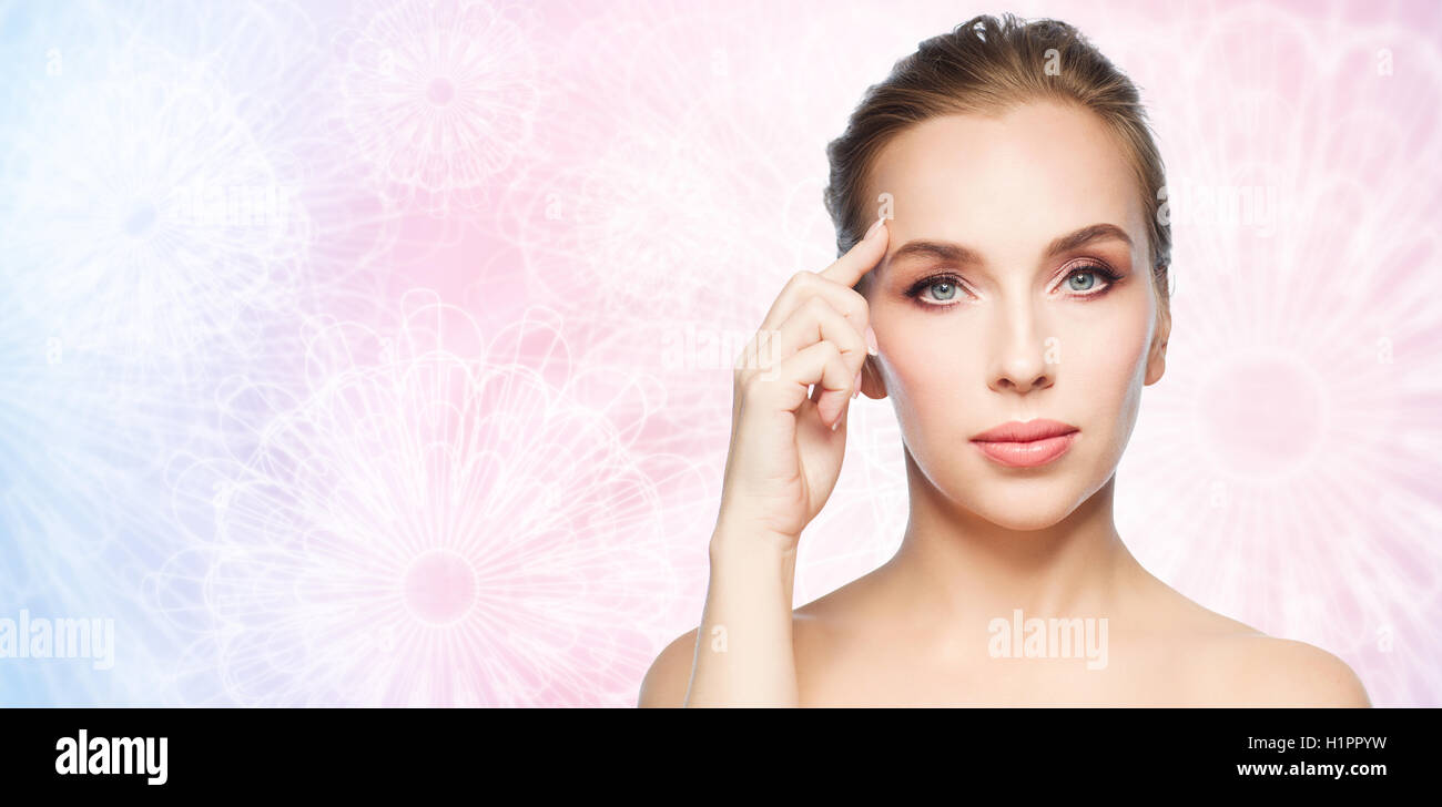 beautiful young woman showing her forehead Stock Photo - Alamy