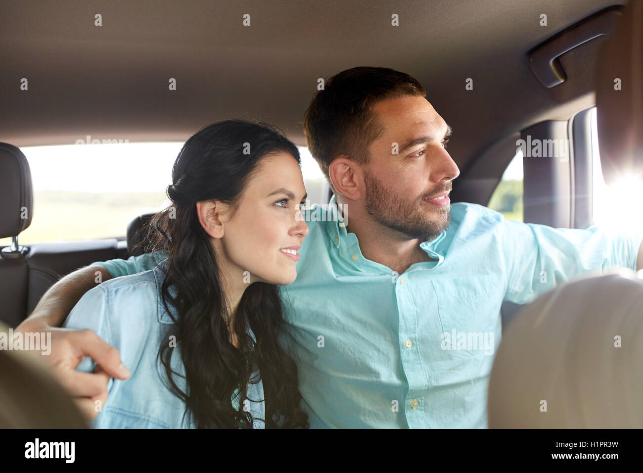Couple hugging in back seat hi-res stock photography and images - Alamy